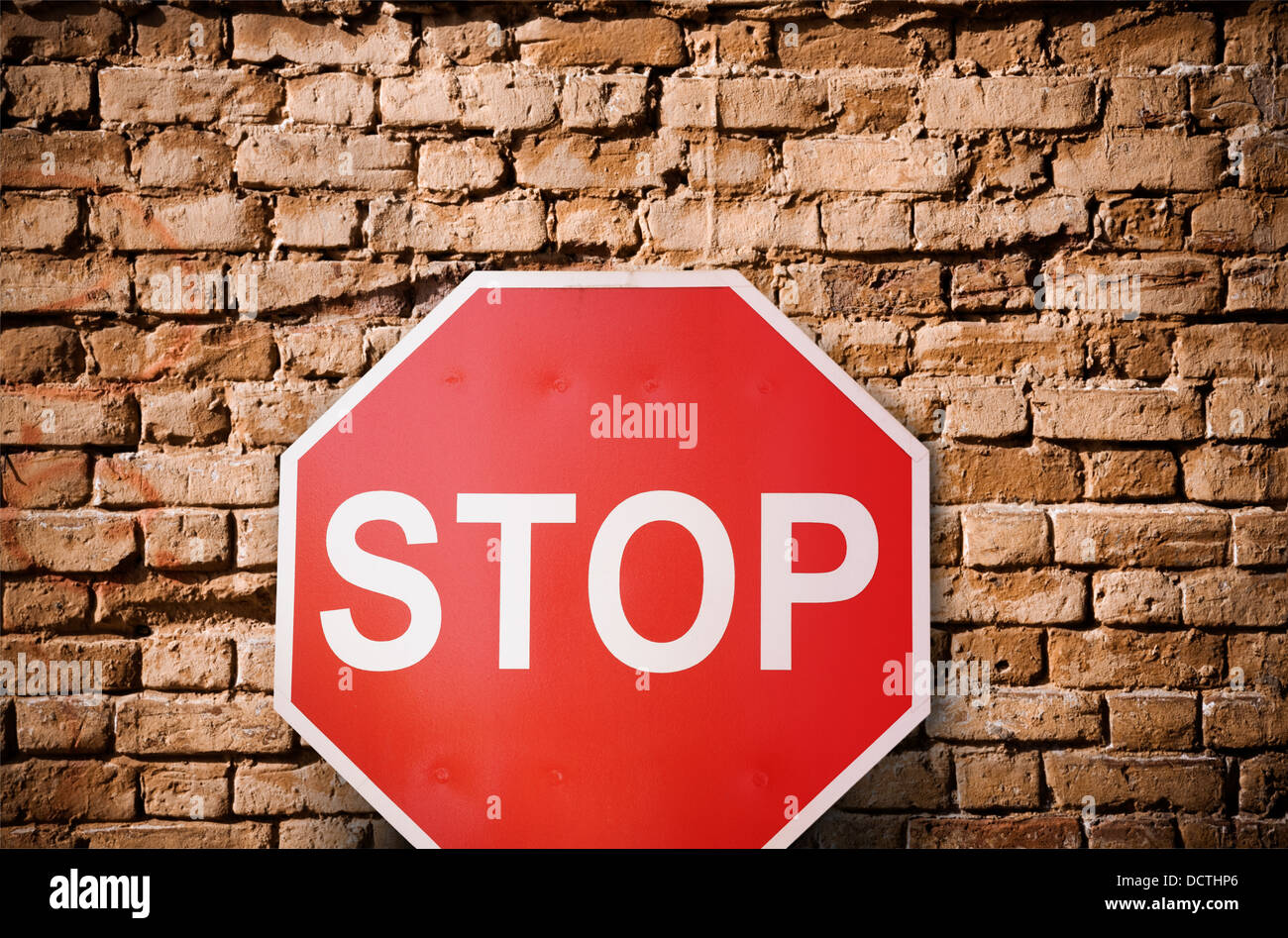 Stop sign on brick hi-res stock photography and images - Alamy