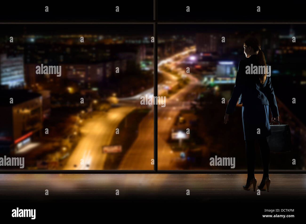 Business woman standing at the window Stock Photo - Alamy