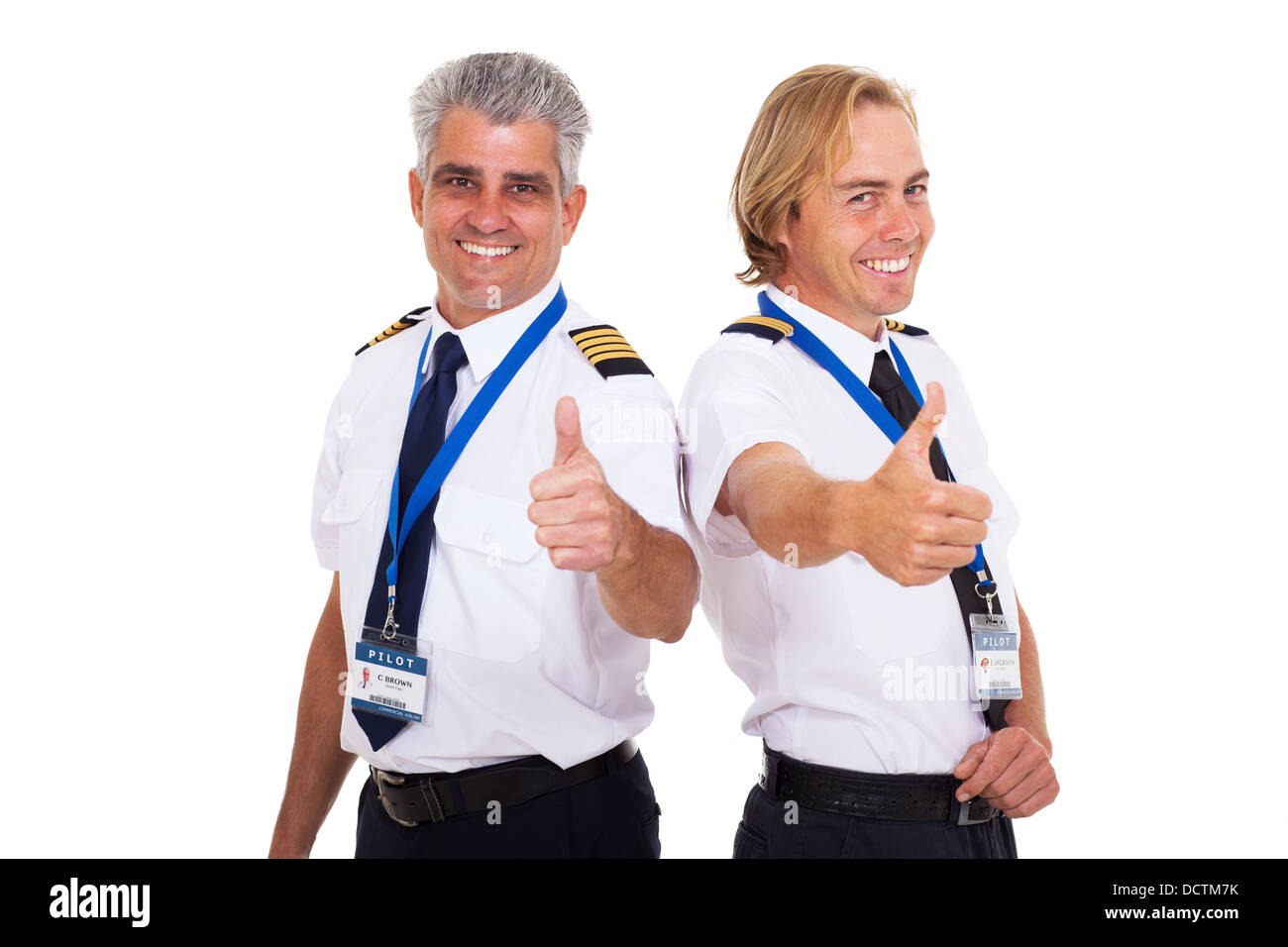 happy airline pilots giving thumbs up isolated on white Stock Photo - Alamy