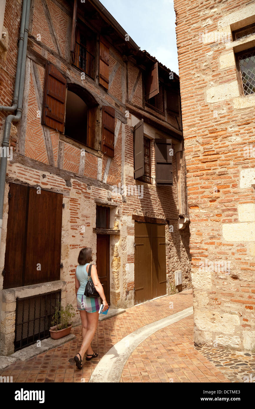 Street scene with medieval brick buildings in the medieval town of Agen ...