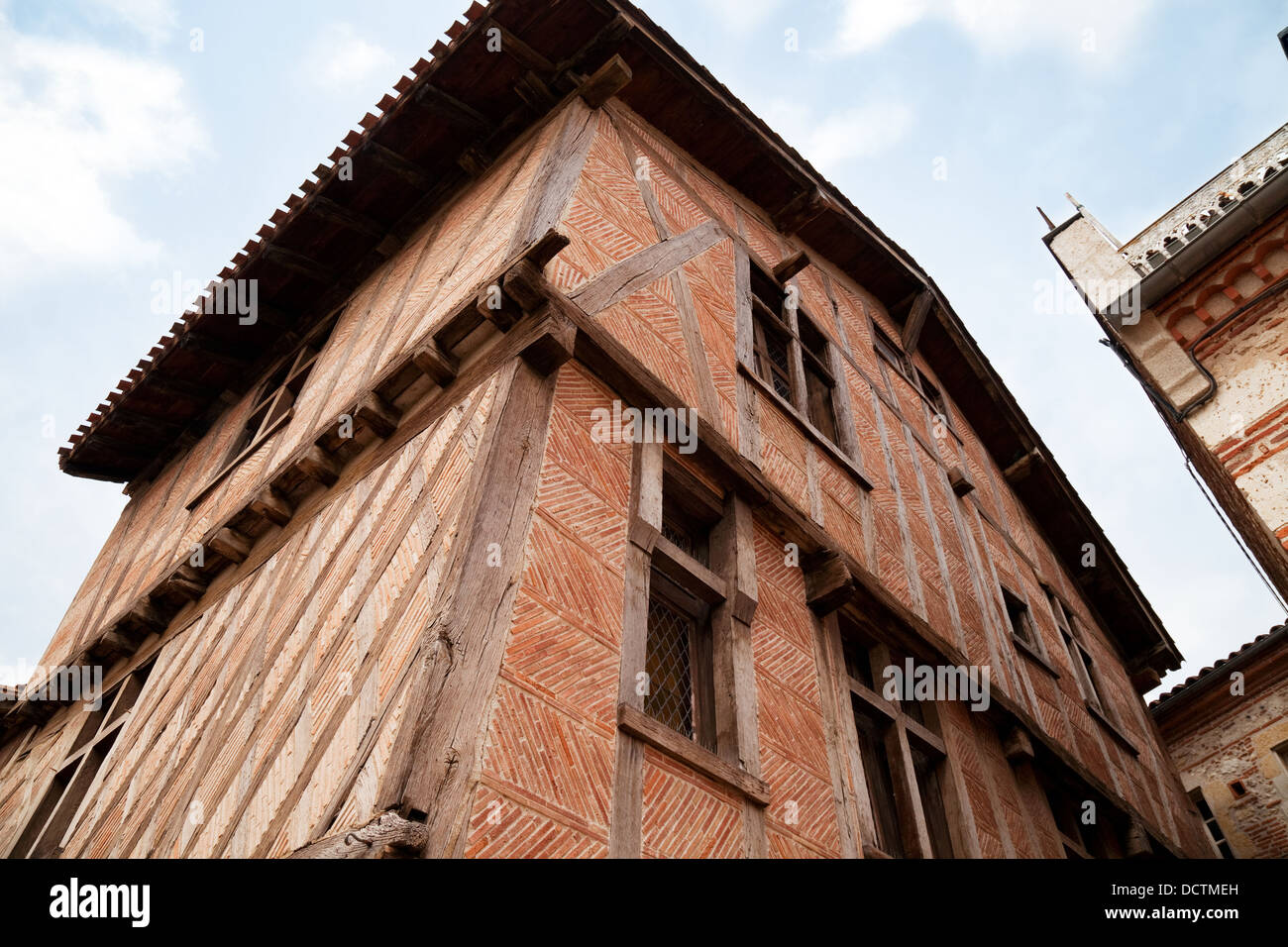 Street scene with medieval brick buildings in the town of Agen, Lot et ...