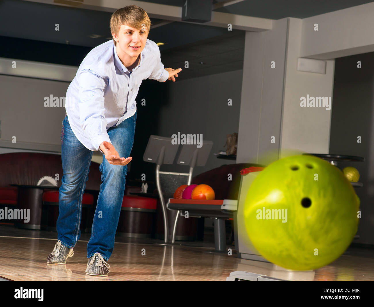 young man playing bowling Stock Photo - Alamy