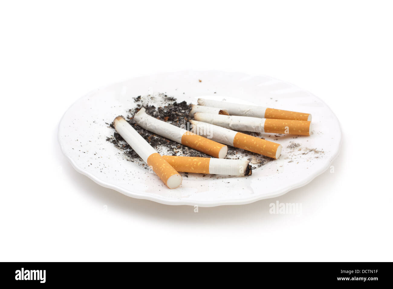 cigarette buts on plate Stock Photo - Alamy