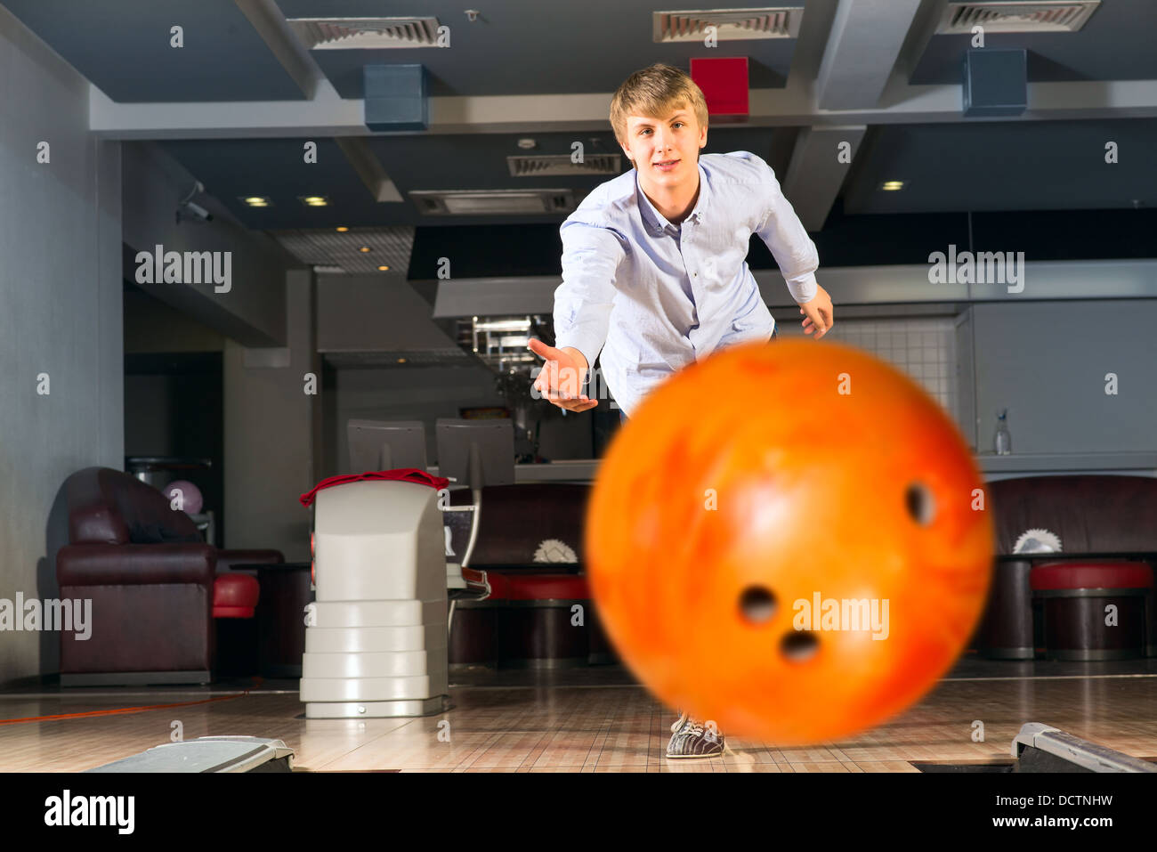 young man playing bowling Stock Photo - Alamy