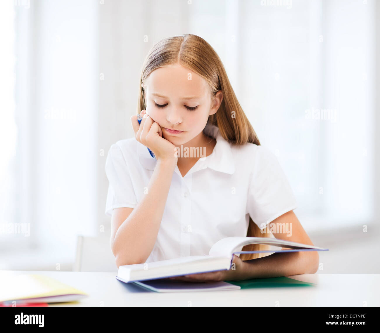 student girl studying at school Stock Photo - Alamy