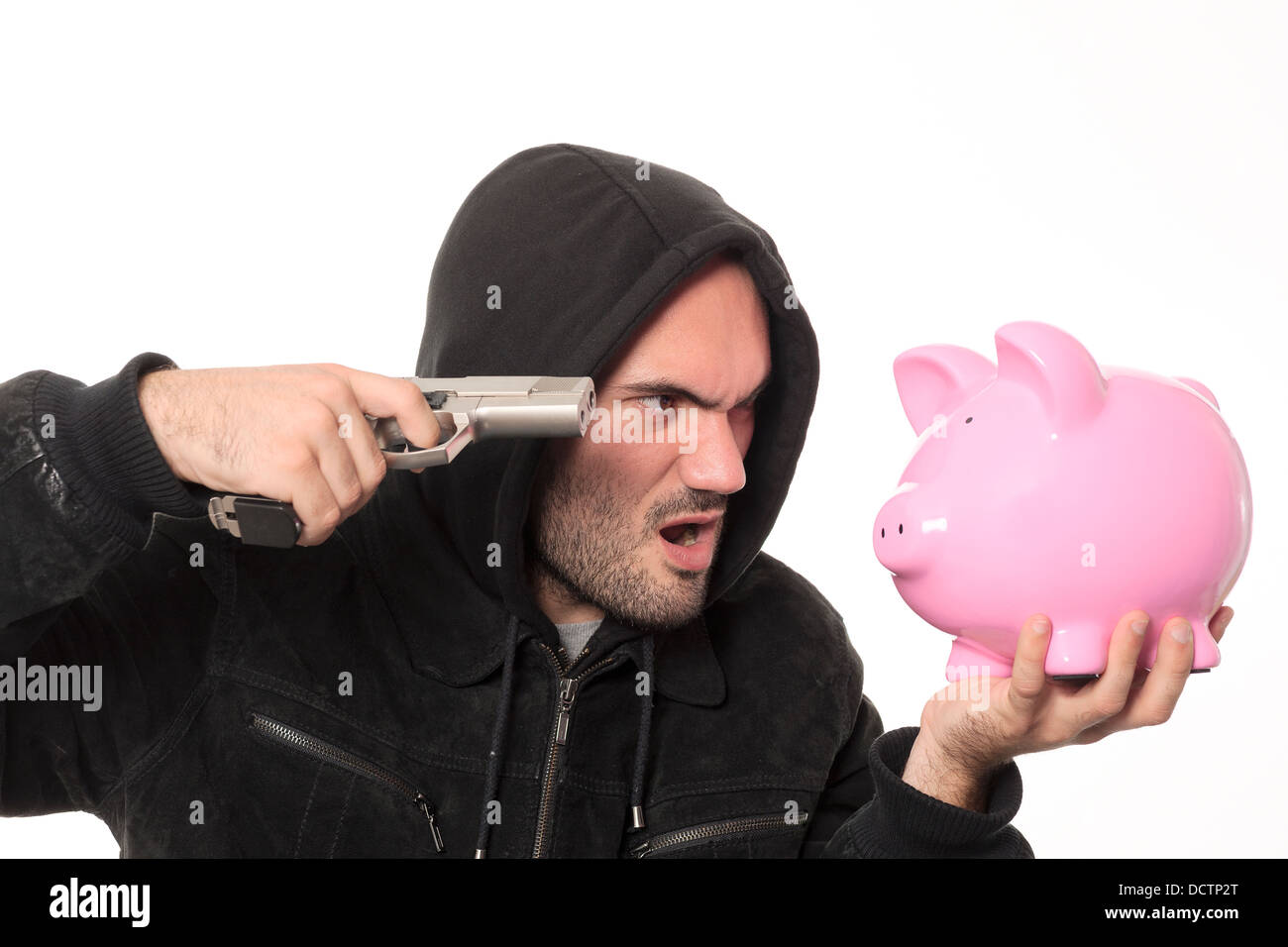 Piggy bank hand gun hi-res stock photography and images - Alamy