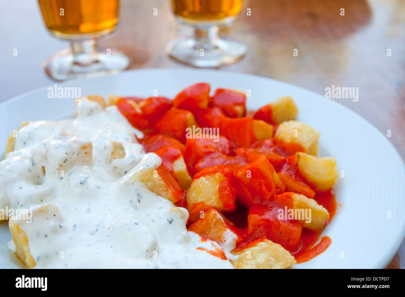 Spanish appetizer: Alioli and Bravas potatoes, close view. Madrid ...