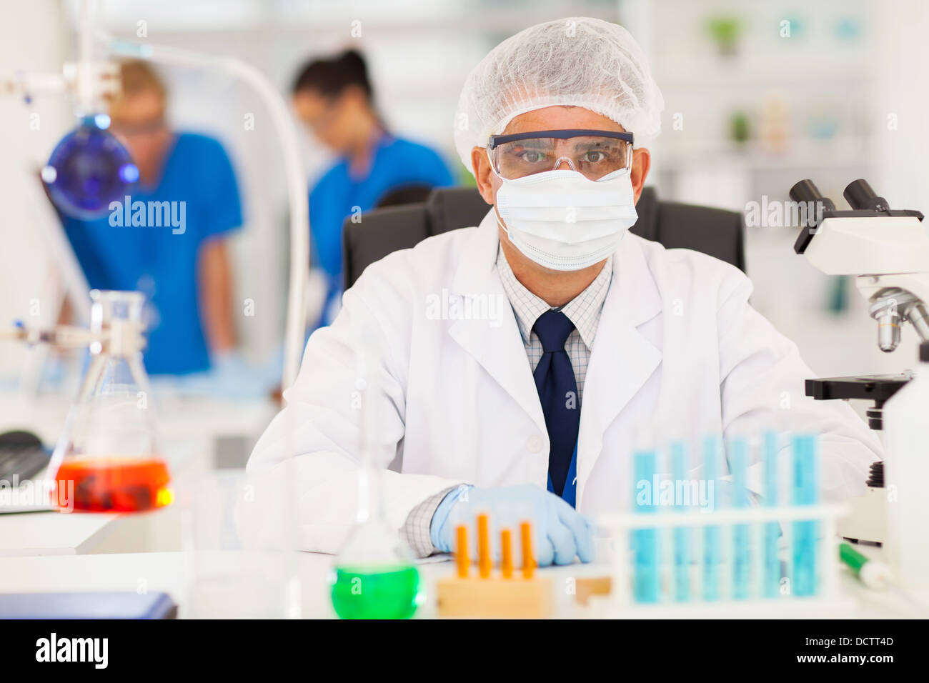 senior scientist with tubes working in the laboratory Stock Photo - Alamy