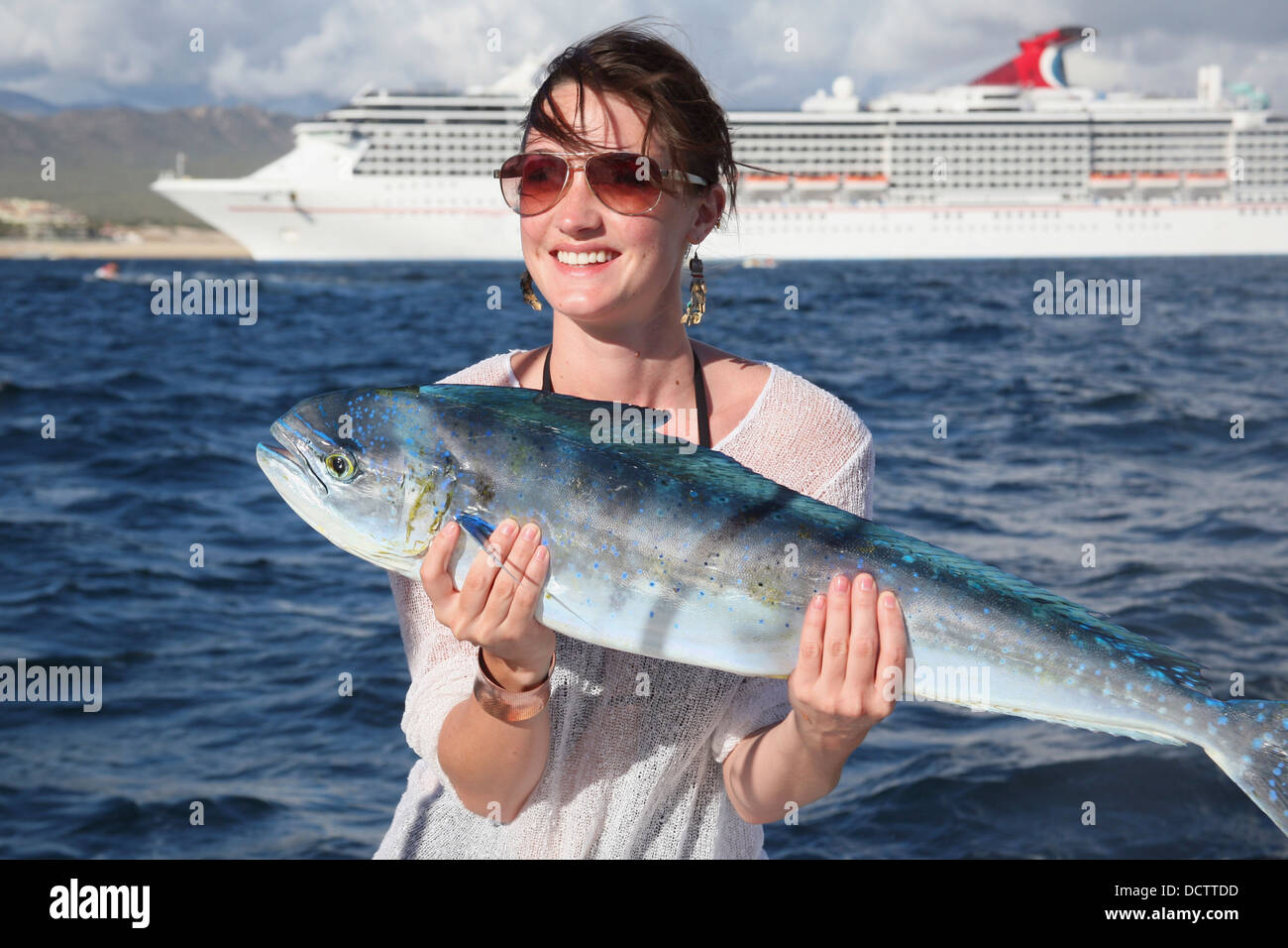 Woman Holding Large Fish, Cabo San Lucas, Mexico Stock Photo - Alamy