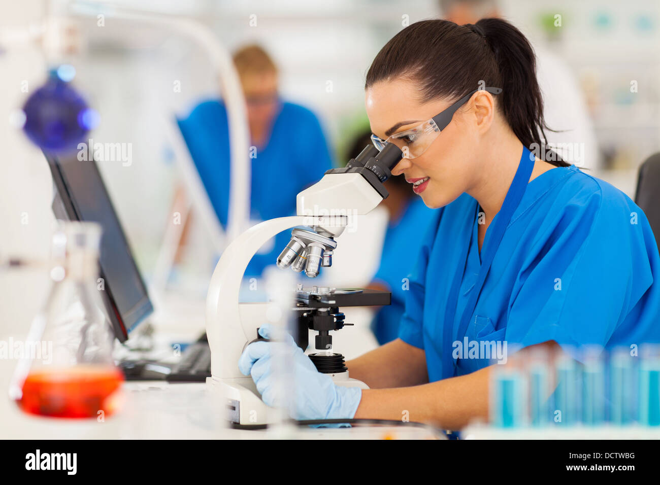 Scientist work looking in microscope hi-res stock photography and images - Alamy