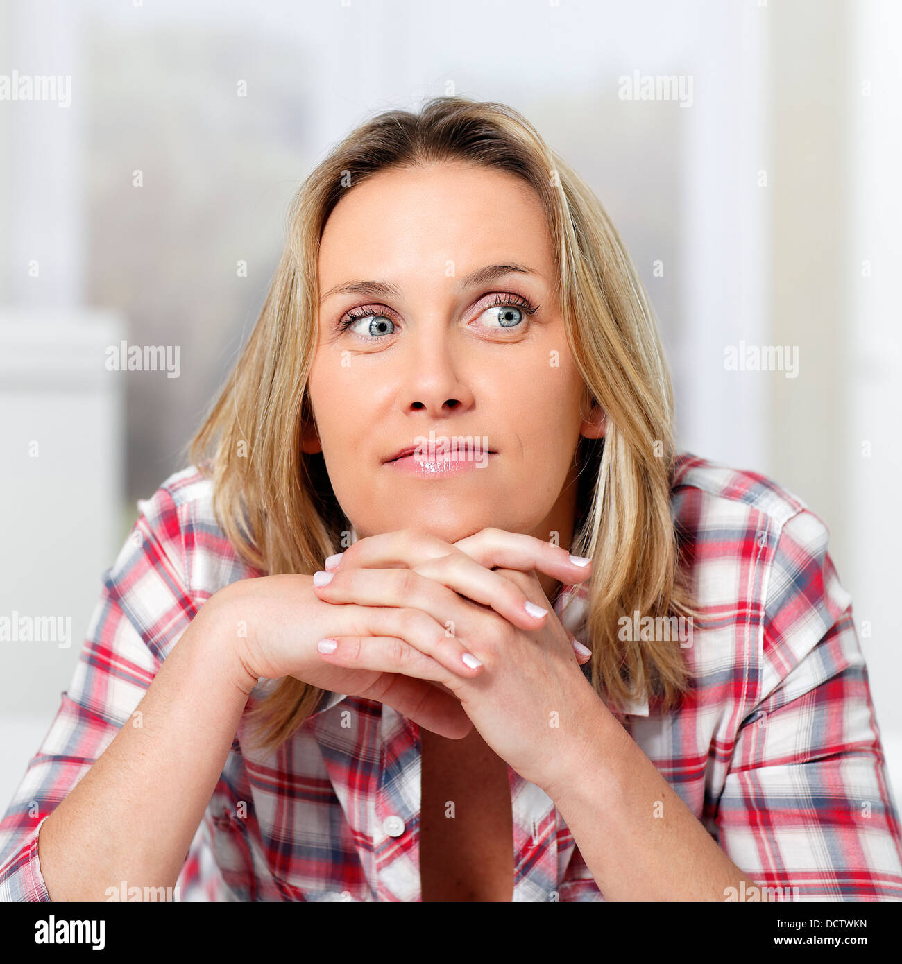 pensive woman square Stock Photo - Alamy