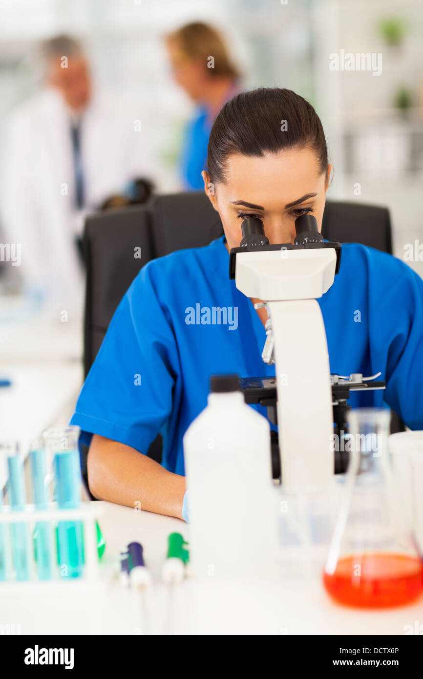 smart female scientist using microscope in laboratory Stock Photo - Alamy