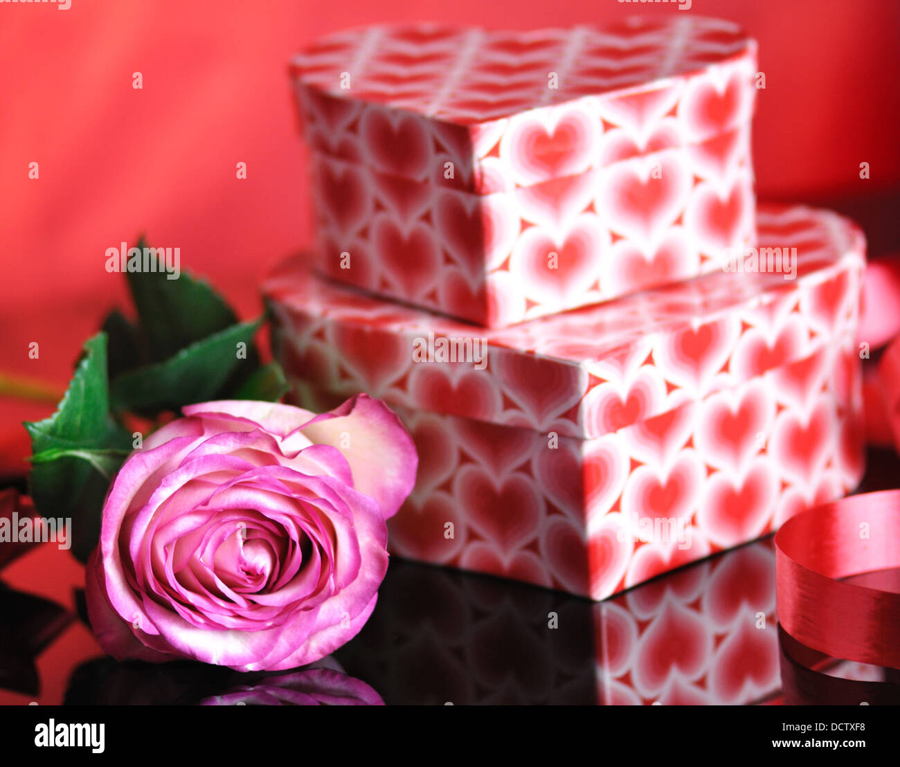 pink rose and gift boxes Stock Photo - Alamy