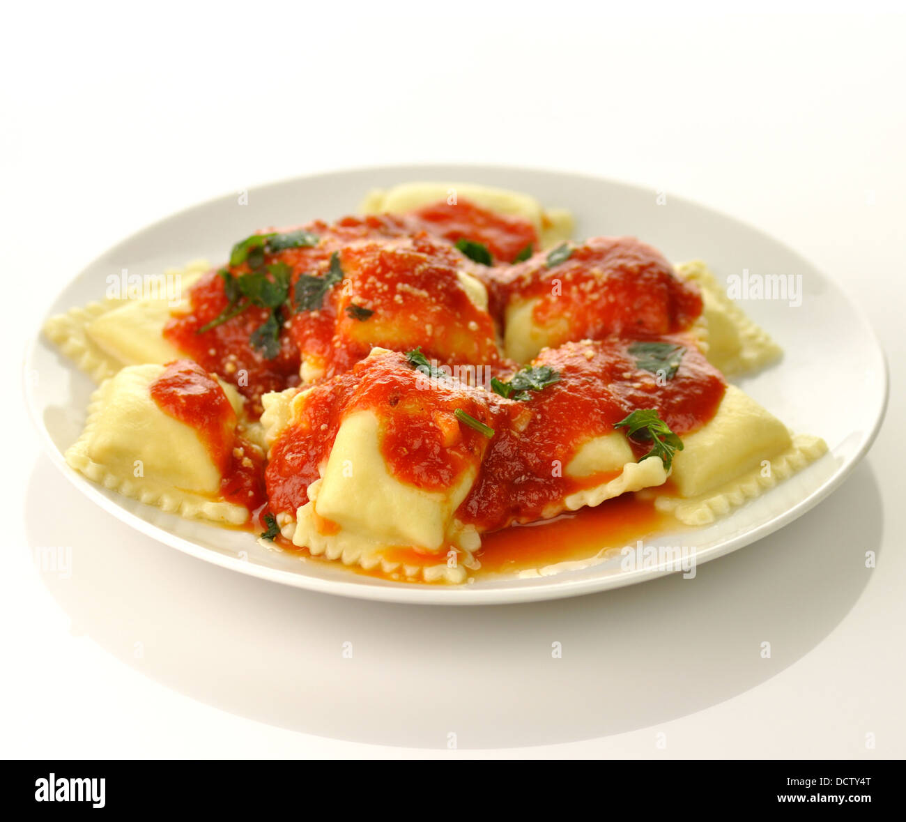 Ravioli pasta with red tomato sauce Stock Photo - Alamy