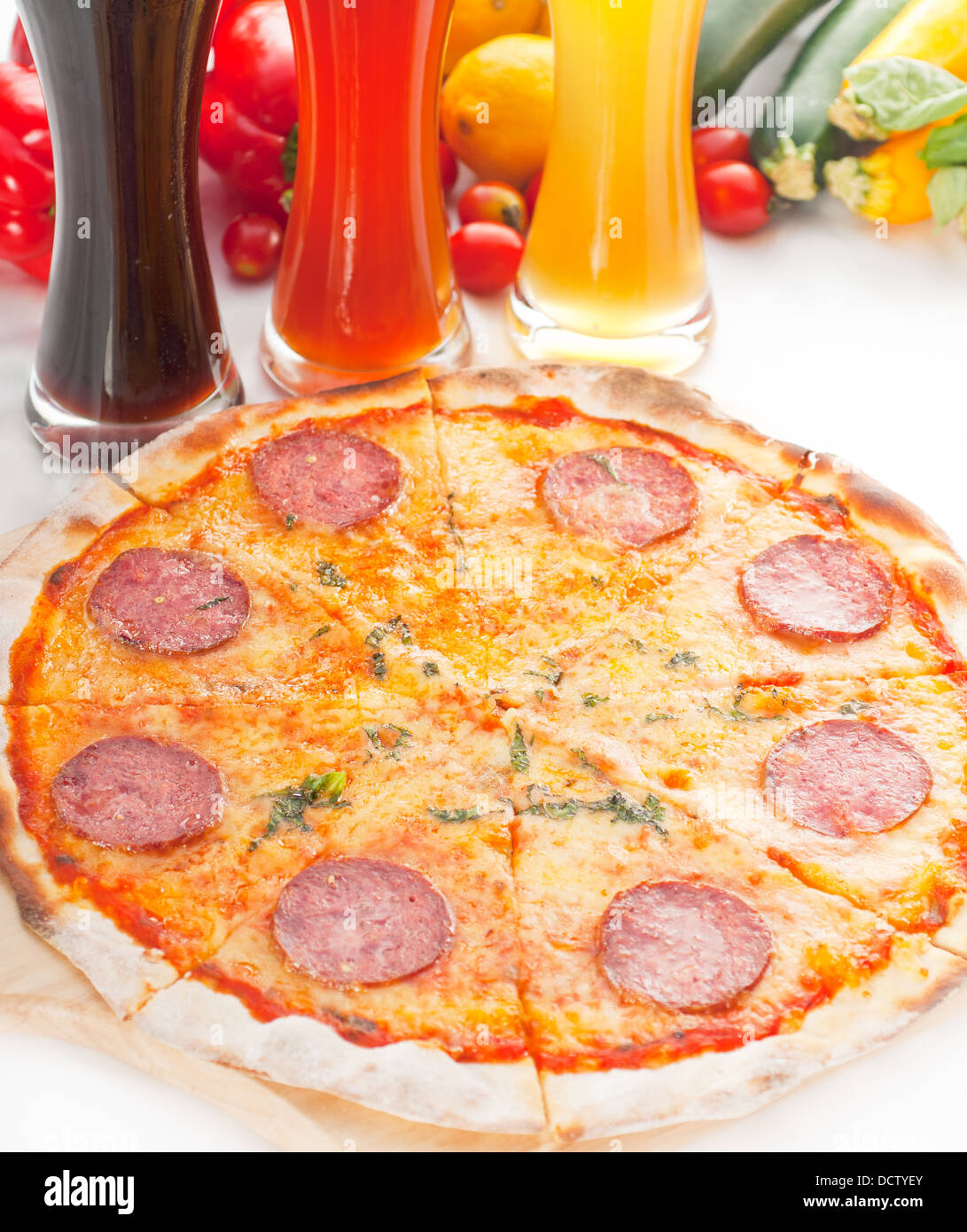 Italian original thin crust pepperoni pizza Stock Photo - Alamy