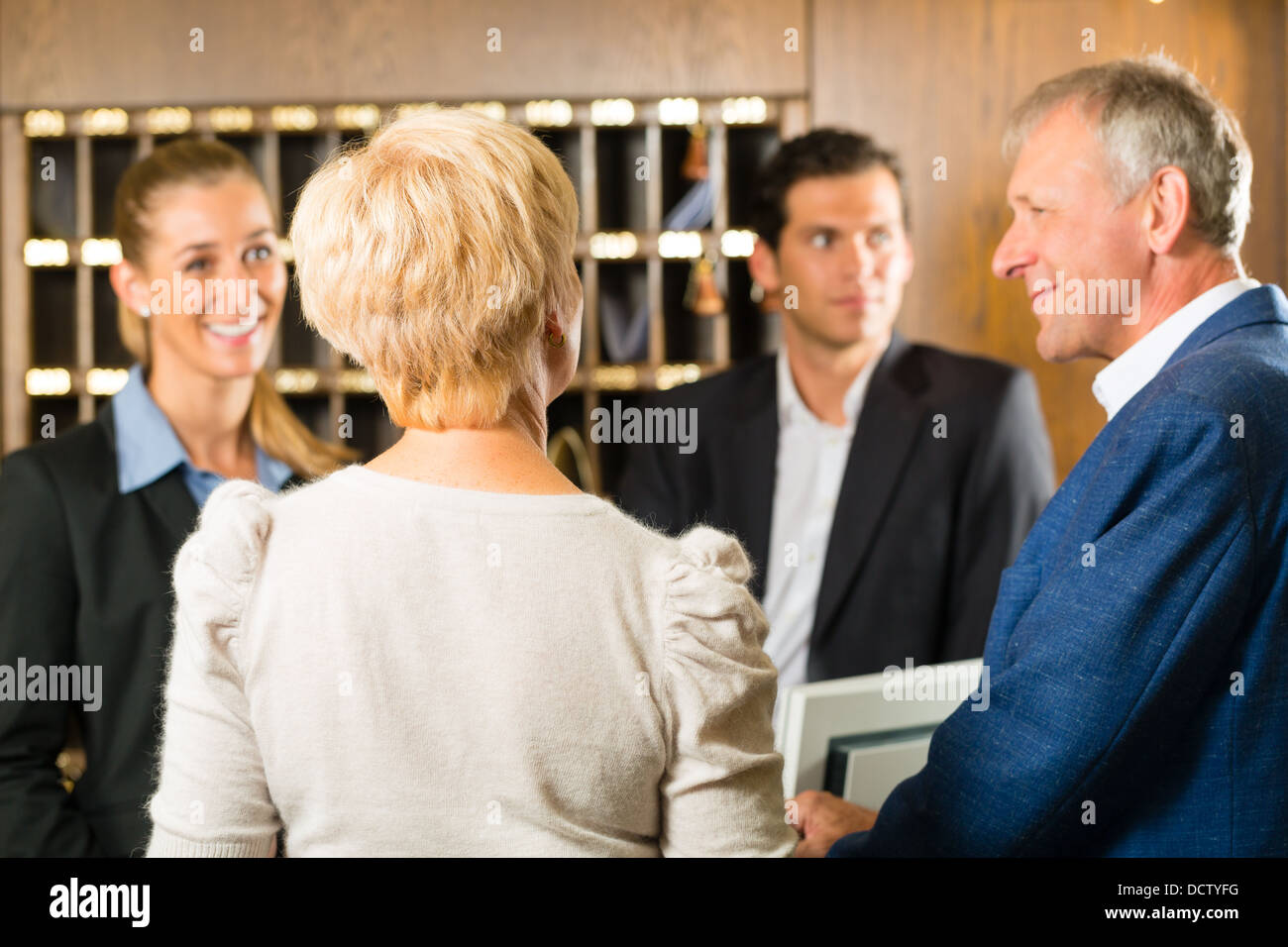 Reception - Guests check in at hotel and getting information Stock ...