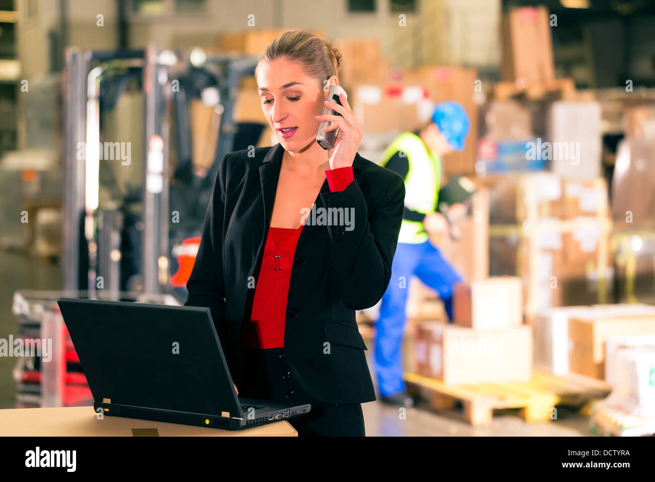 dispatcher using phone at warehouse of forwarding Stock Photo - Alamy