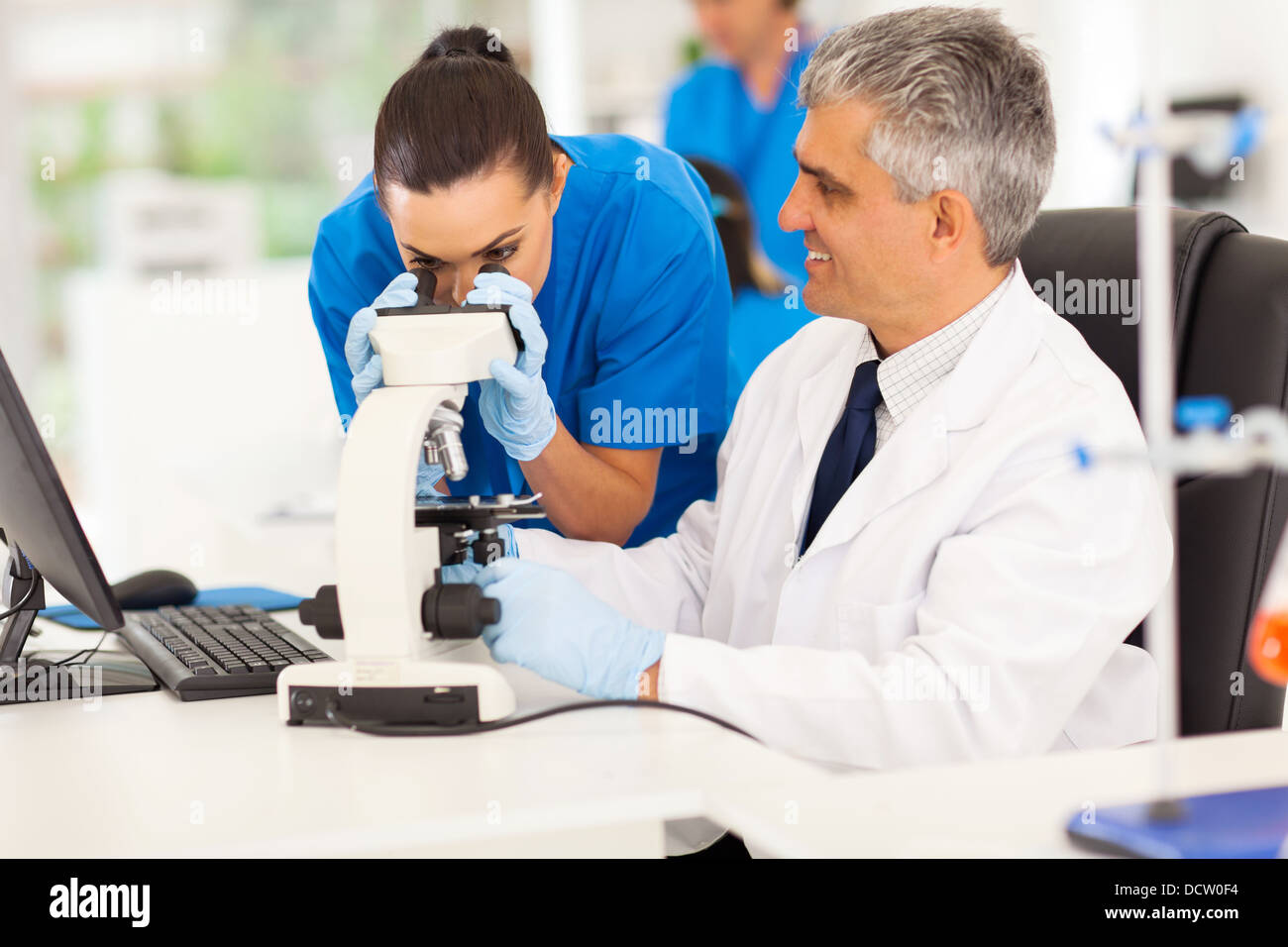 Helping junior workers hi-res stock photography and images - Alamy