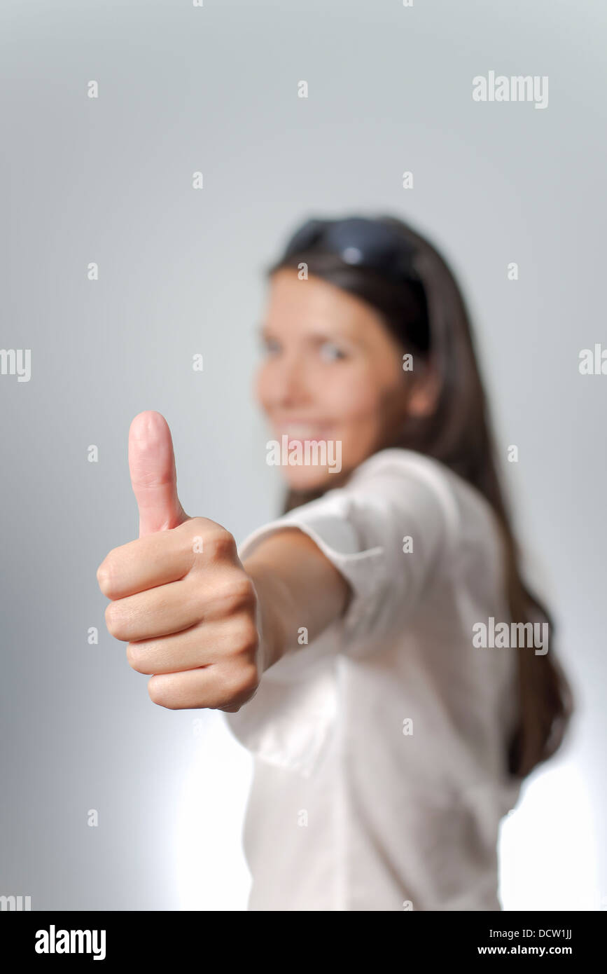 woman making approval sign with her thumb Stock Photo - Alamy