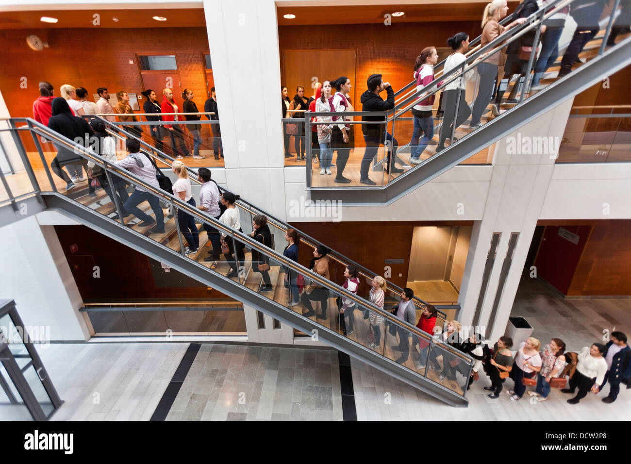 People in a row Stock Photo - Alamy