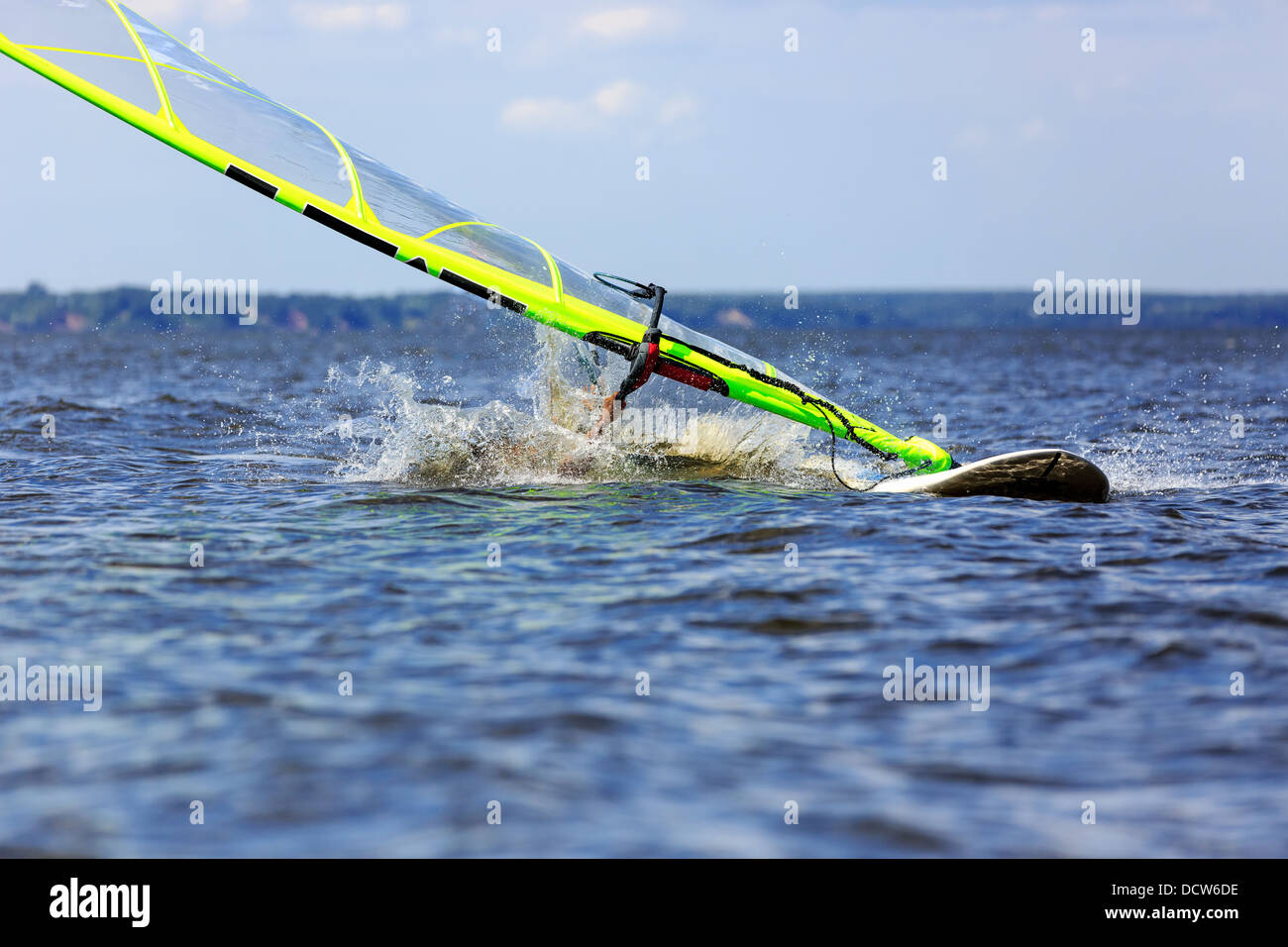 Side view of a windsurfer falls to water Stock Photo - Alamy