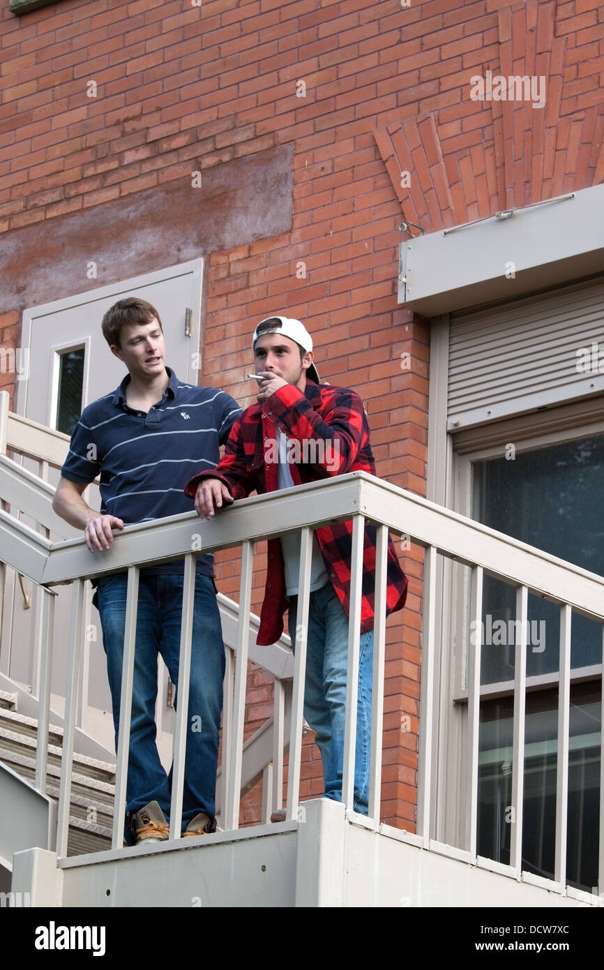Smoking on a balcony hi-res stock photography and images - Alamy