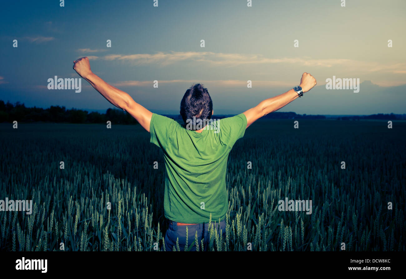 Young man enjoying his freedom/rejoicing from his success Stock Photo ...