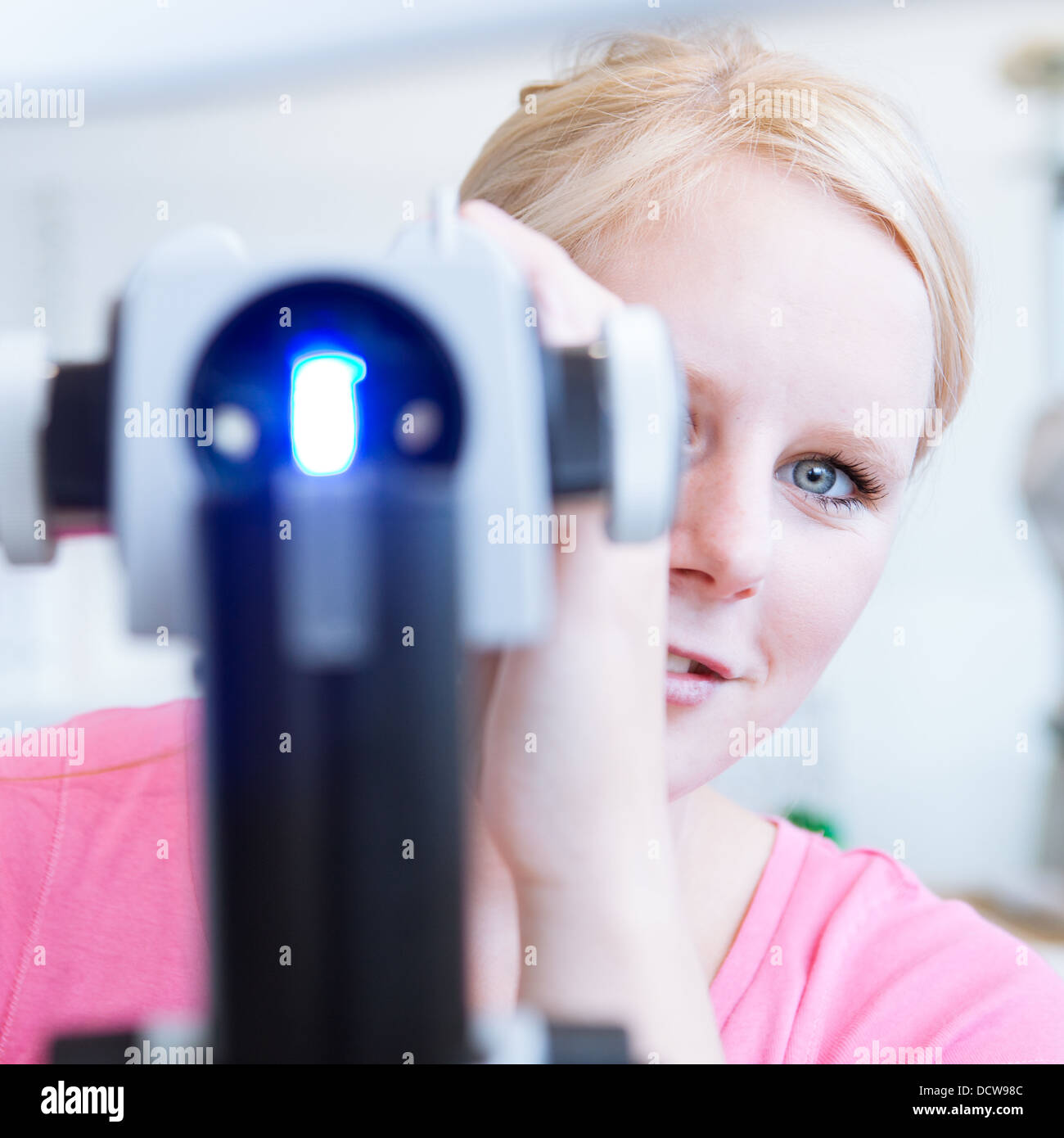optometry concept - portrait of a young pretty optometrist using Stock ...