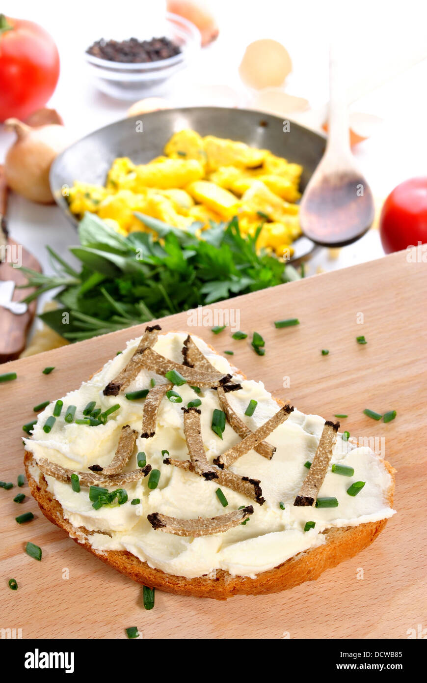 Soft cheese on bread with grated summer truffle Stock Photo - Alamy