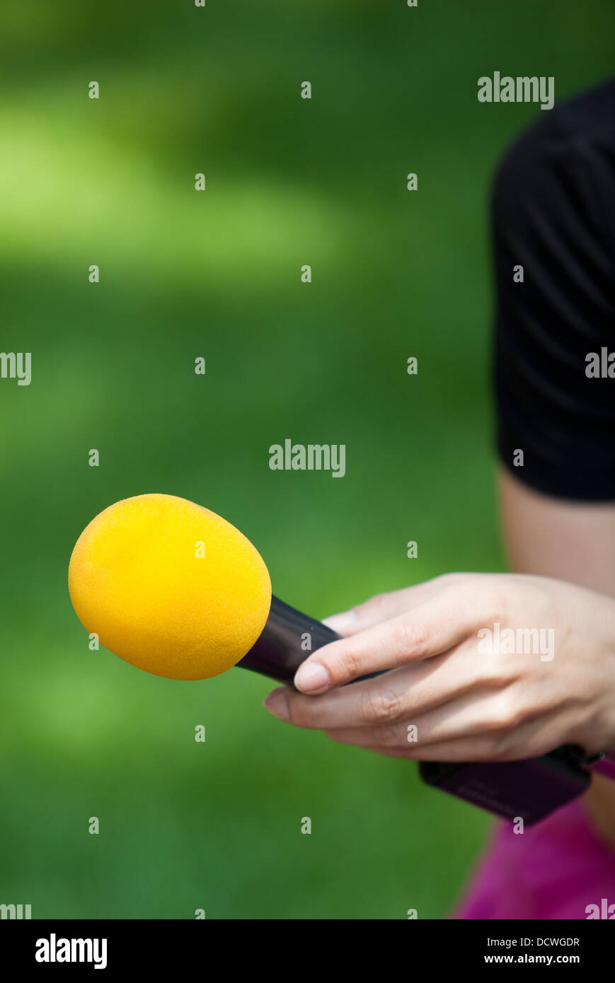 A journalist is making a interview with a microphone Stock Photo - Alamy