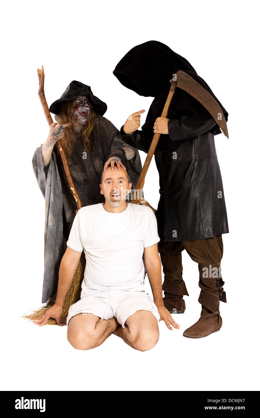 young witch and death fight for victims Stock Photo - Alamy