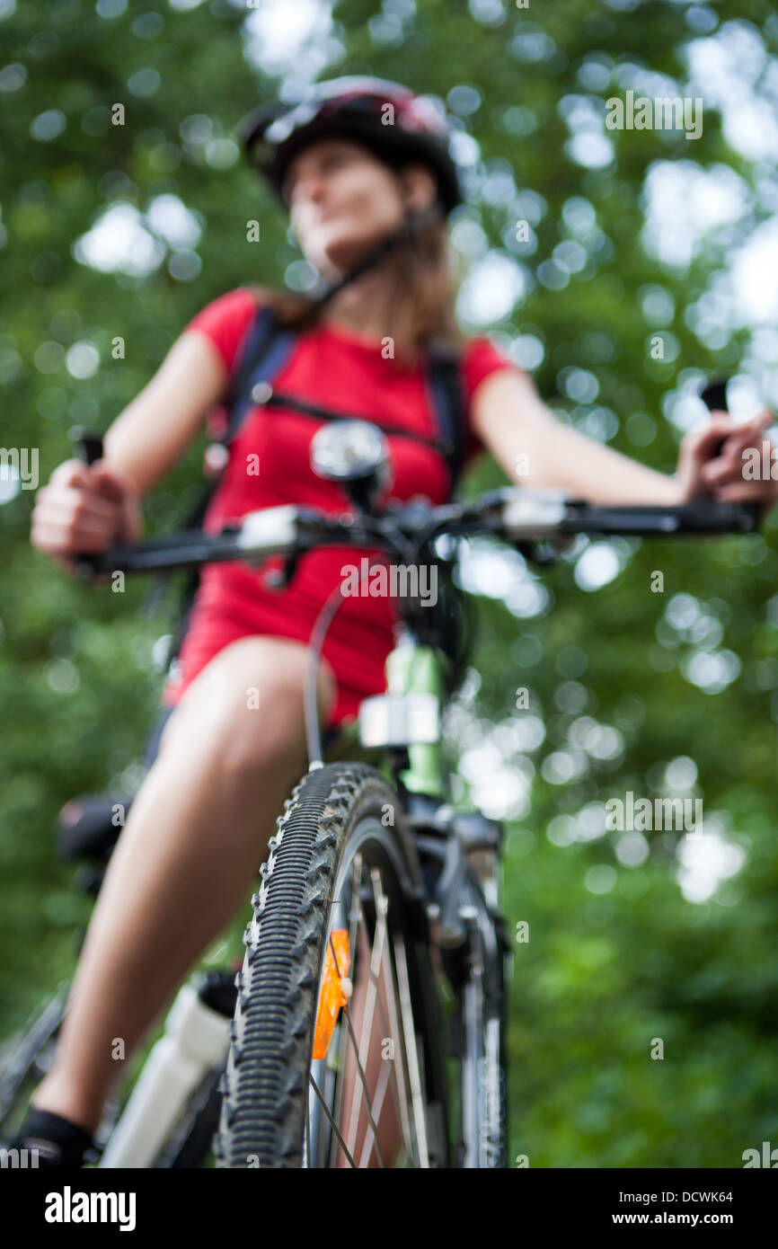 pretty young female biker outddors on her mountain bike Stock Photo - Alamy