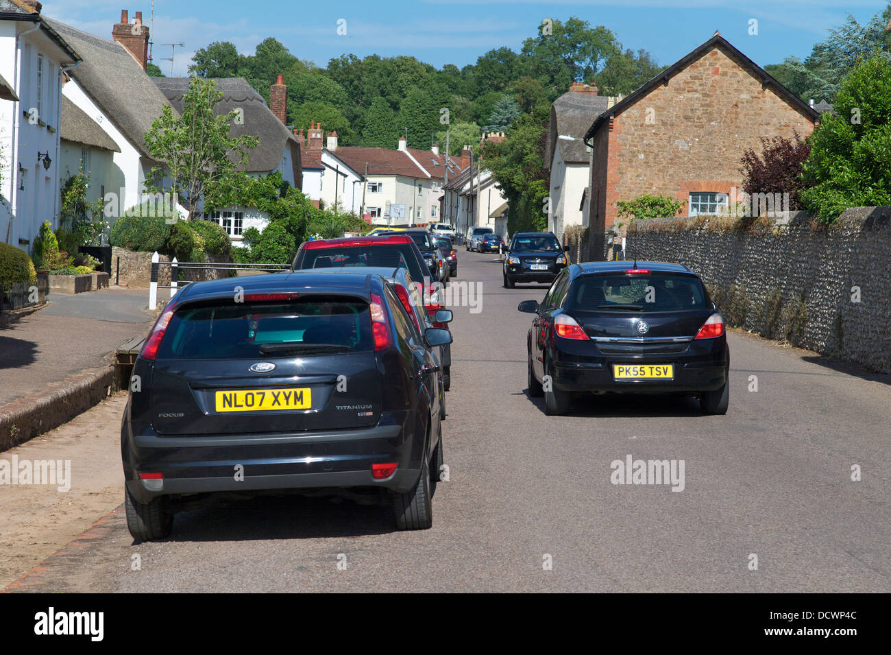 Cars parked in village, UK Stock Photo - Alamy