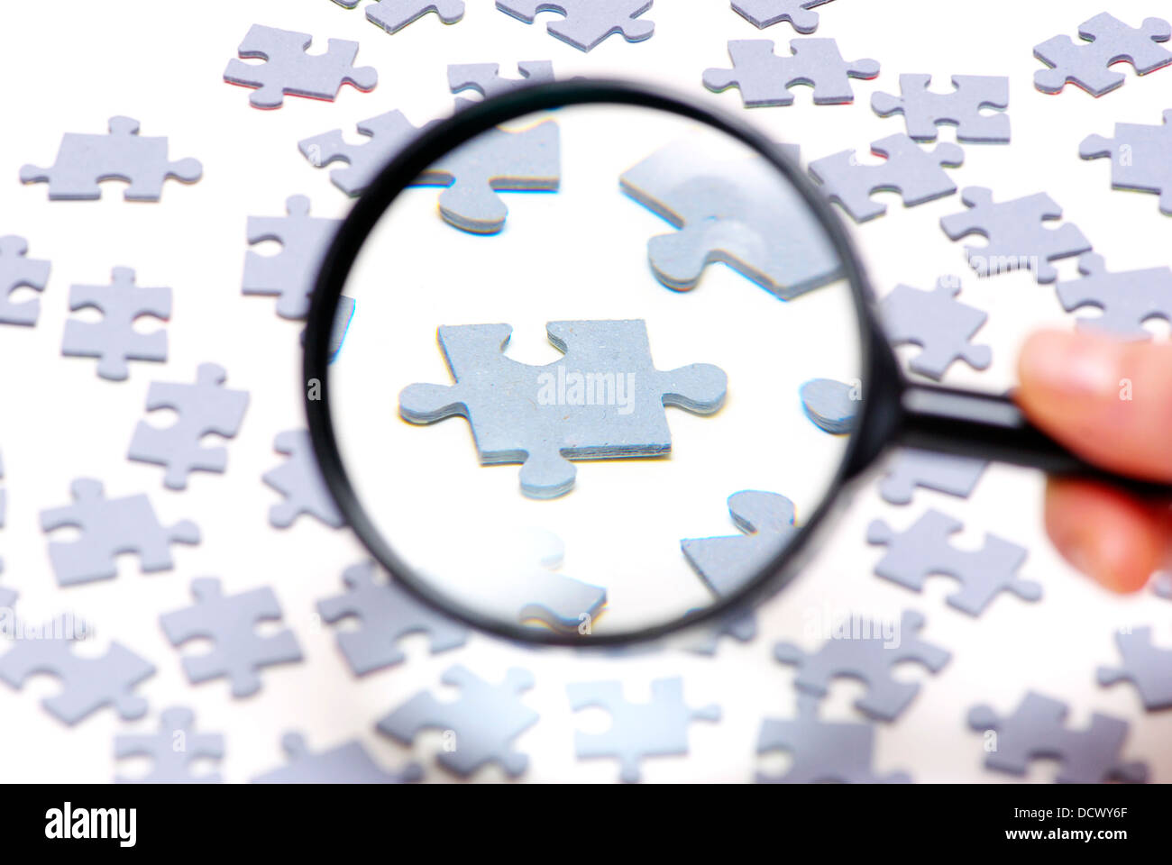 Magnifying glass examining red hi-res stock photography and images - Alamy