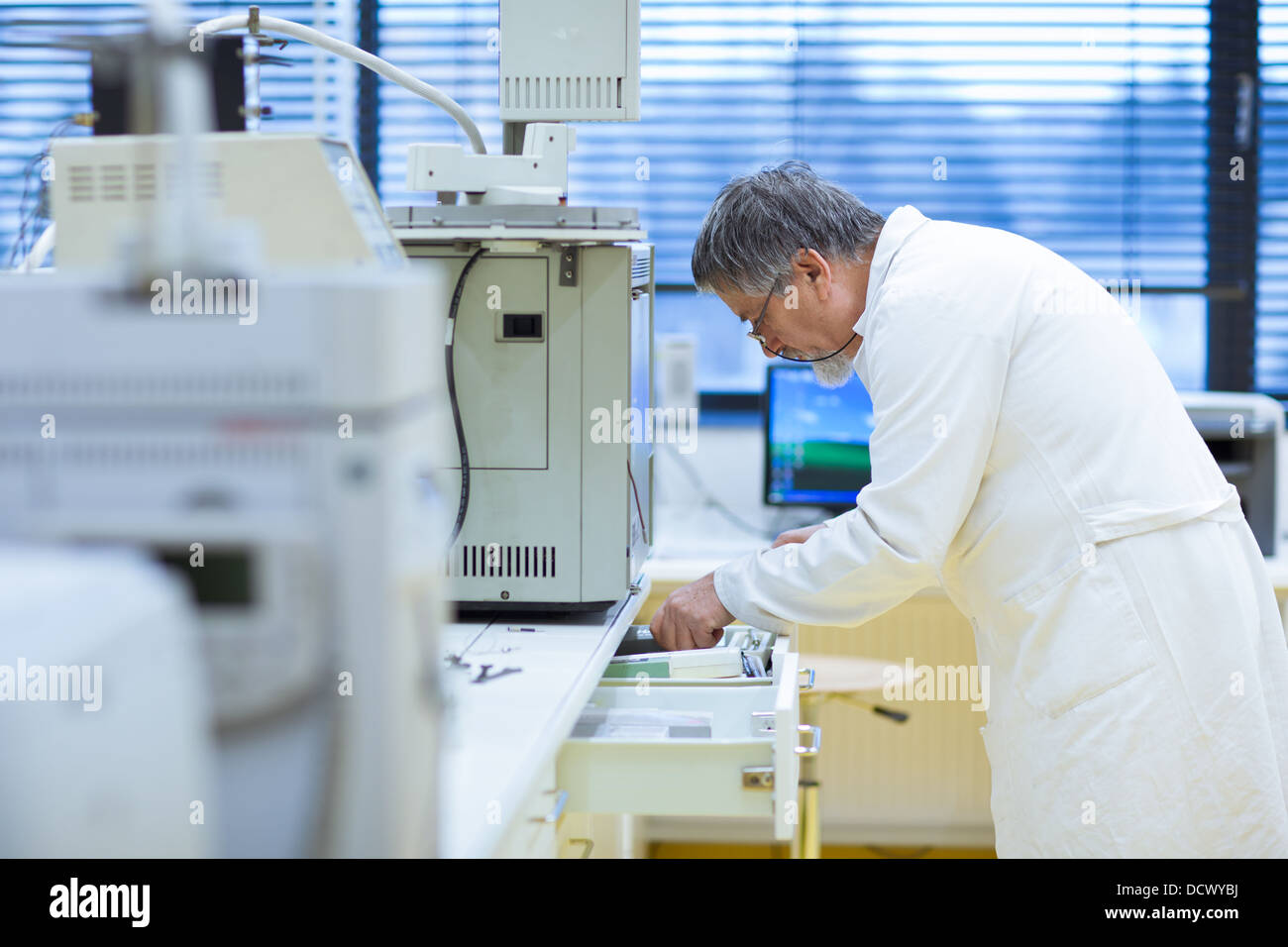senior male researcher carrying out scientific research in a lab Stock ...