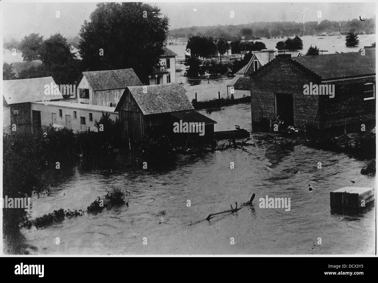 A photograph of a flooded community, depicting the effects of severe ...