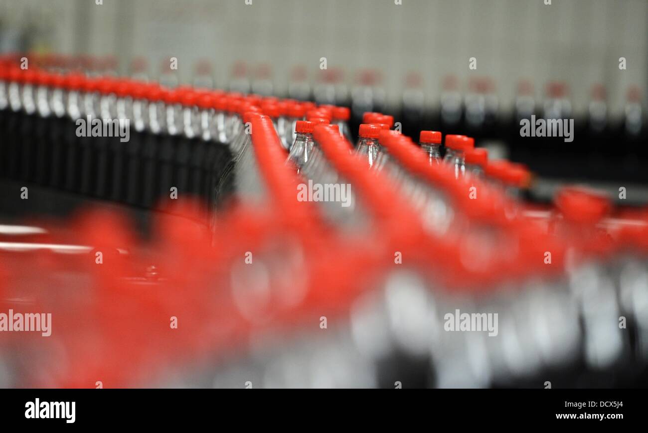 Coca-Cola bottles are pictured on the production line in the bottling ...