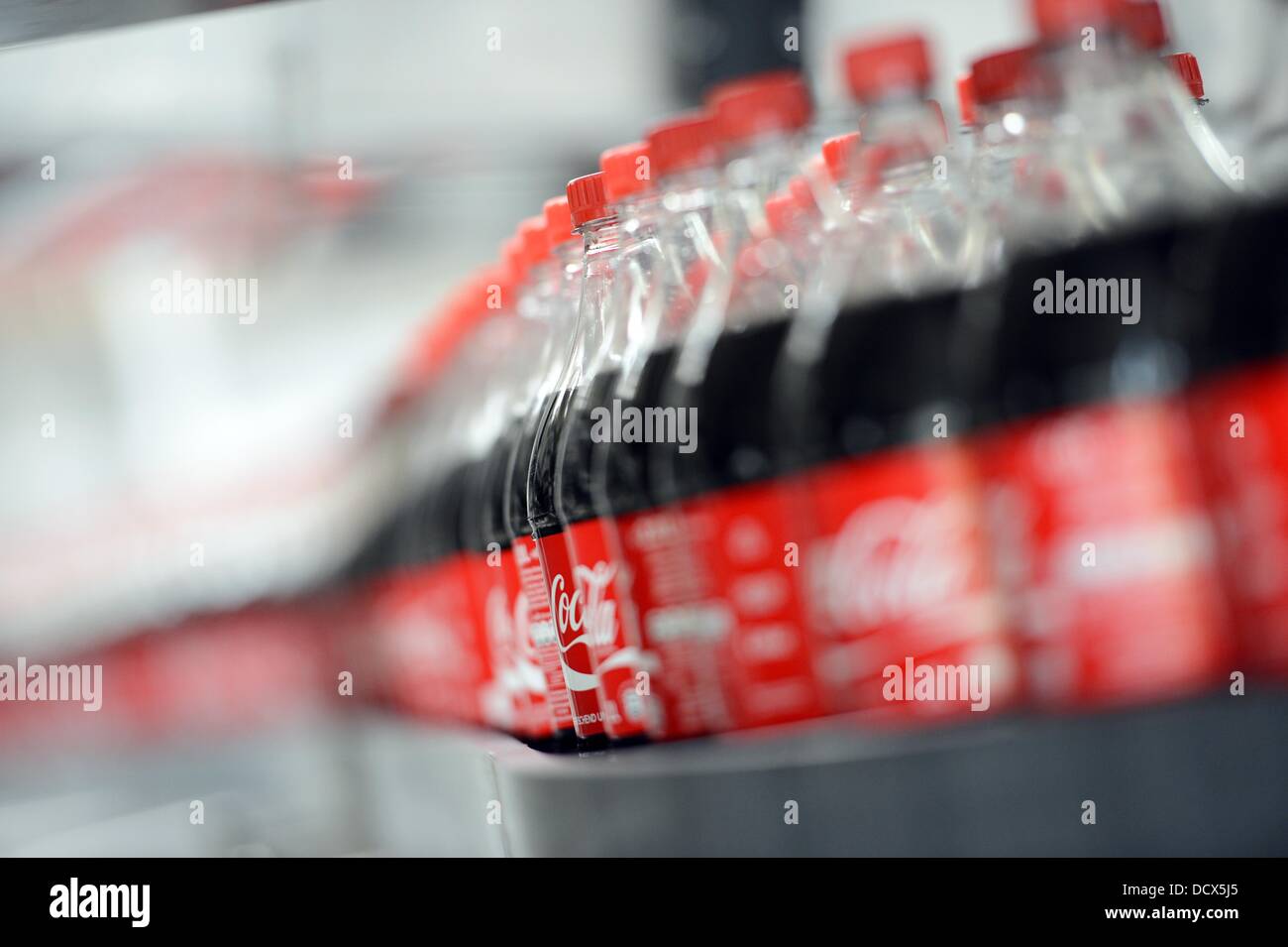 Coca-Cola bottles are pictured on the production line in the bottling ...