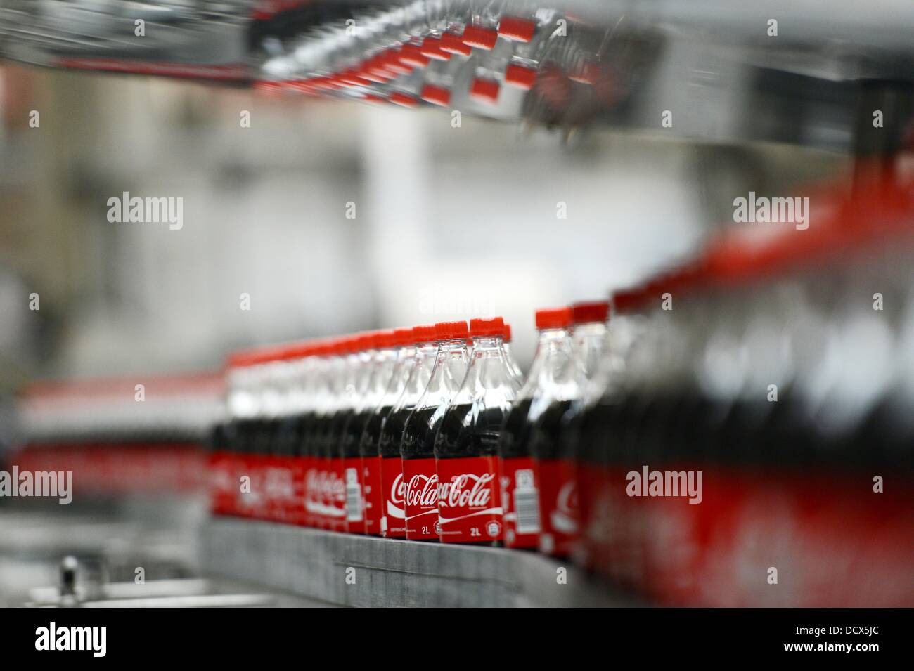 Coca-Cola bottles are pictured on the production line in the bottling ...