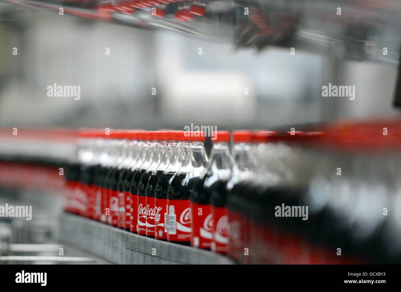 Coca-Cola bottles are pictured on the production line in the bottling ...
