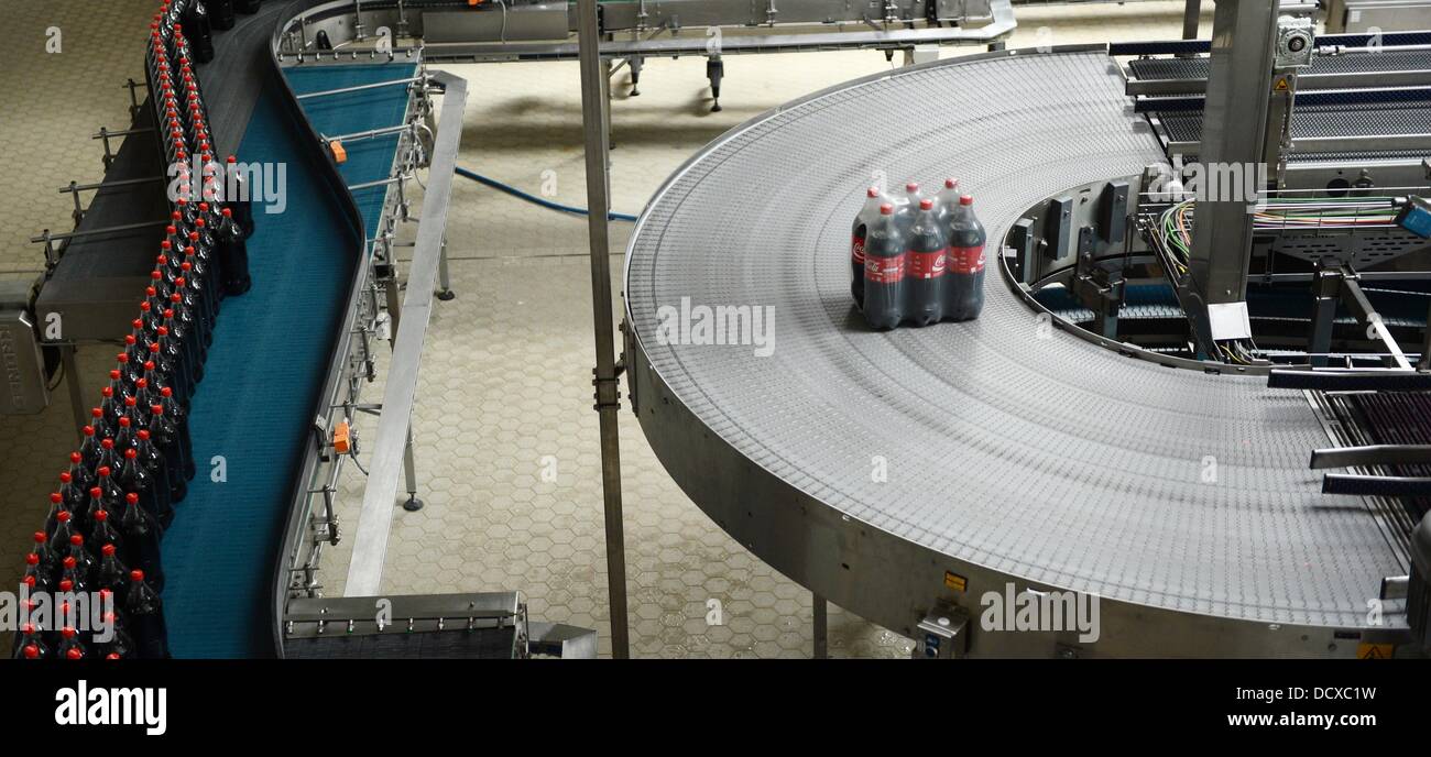 Coca-Cola bottles are pictured on the production line in the bottling ...