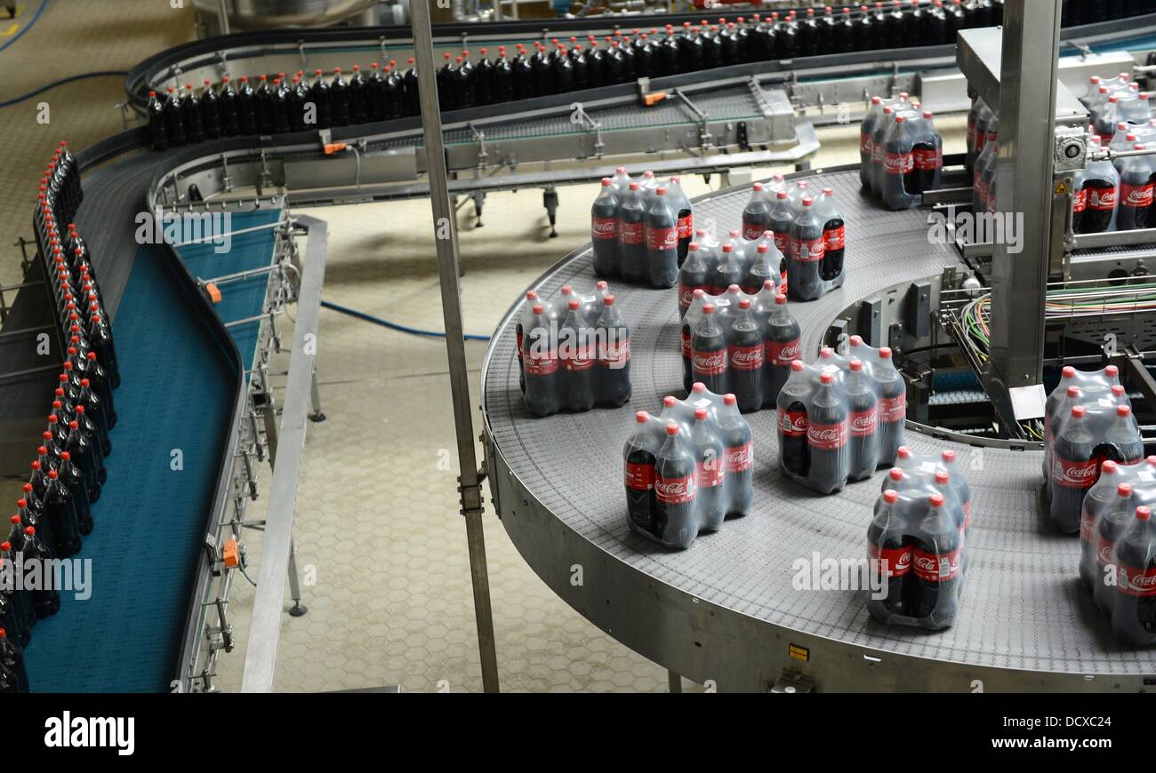 Coca-Cola bottles are pictured on the production line in the bottling ...