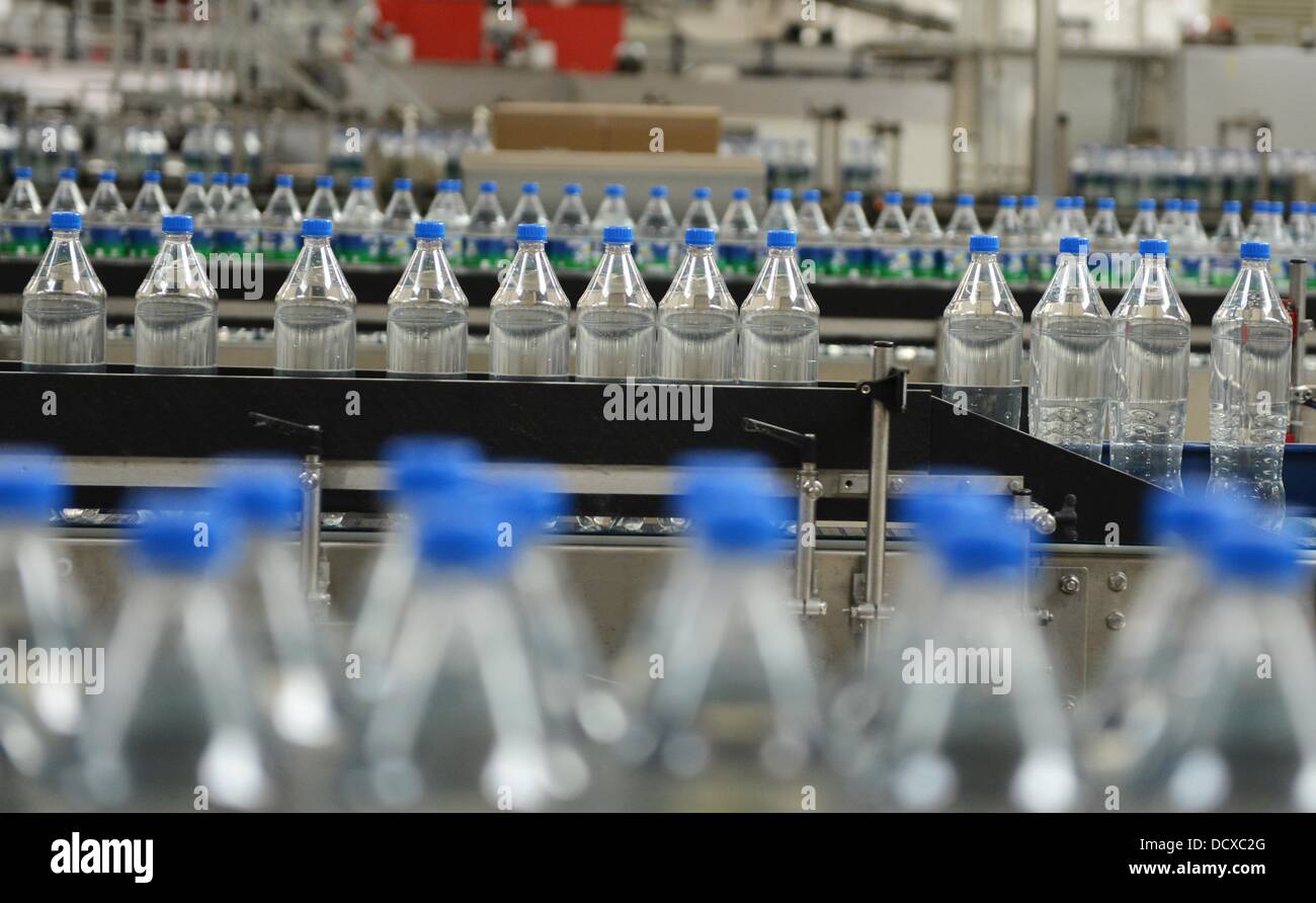 Bottles are pictured on the production line in the bottling plant of ...
