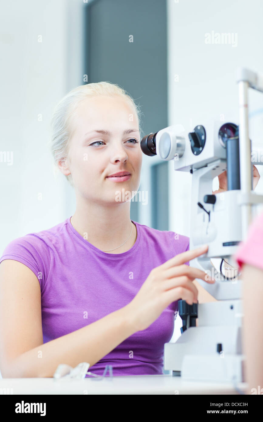 optometry concept - portrait of a young pretty optometrist Stock Photo ...