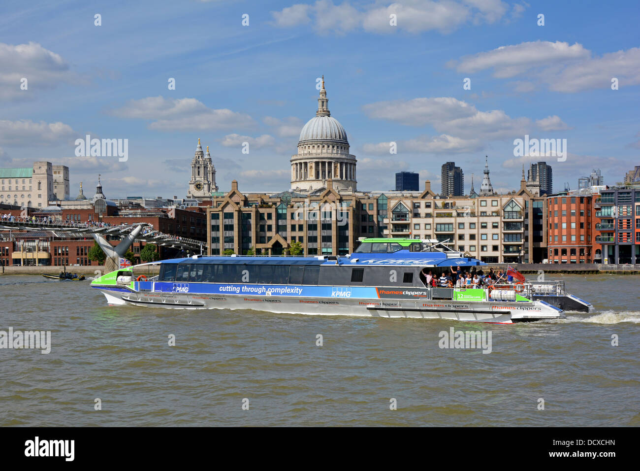River Thames clipper boat with dome of St Pauls cathedral beyond Stock ...