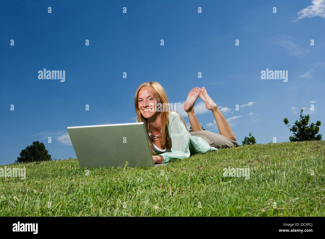 Woman with computer Stock Photo - Alamy
