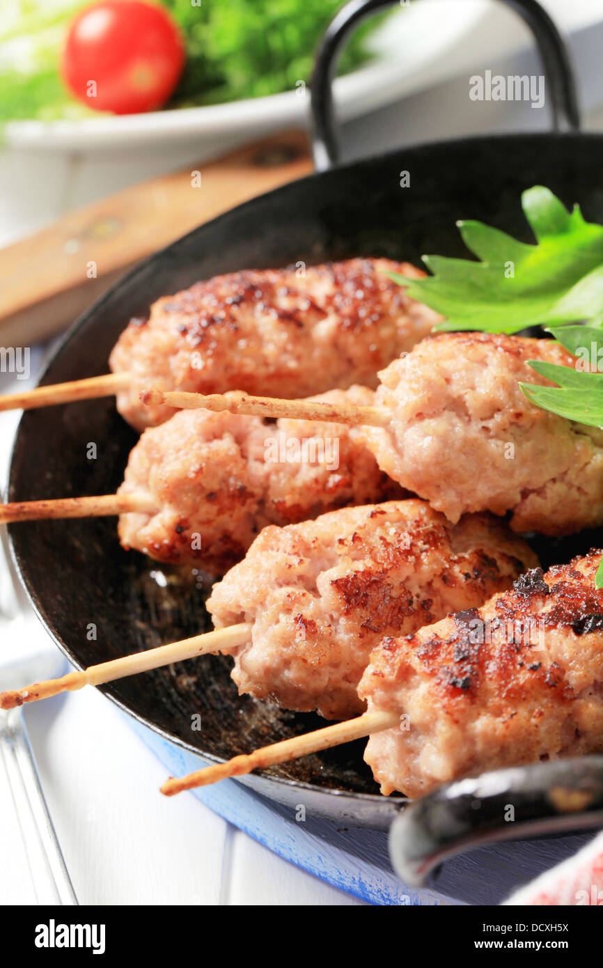 Minced meat kebabs on wooden sticks Stock Photo - Alamy