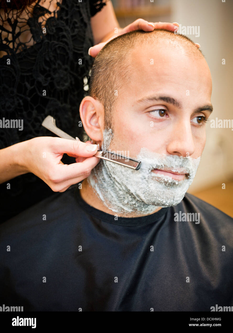 Shaving at the hair salon Stock Photo - Alamy