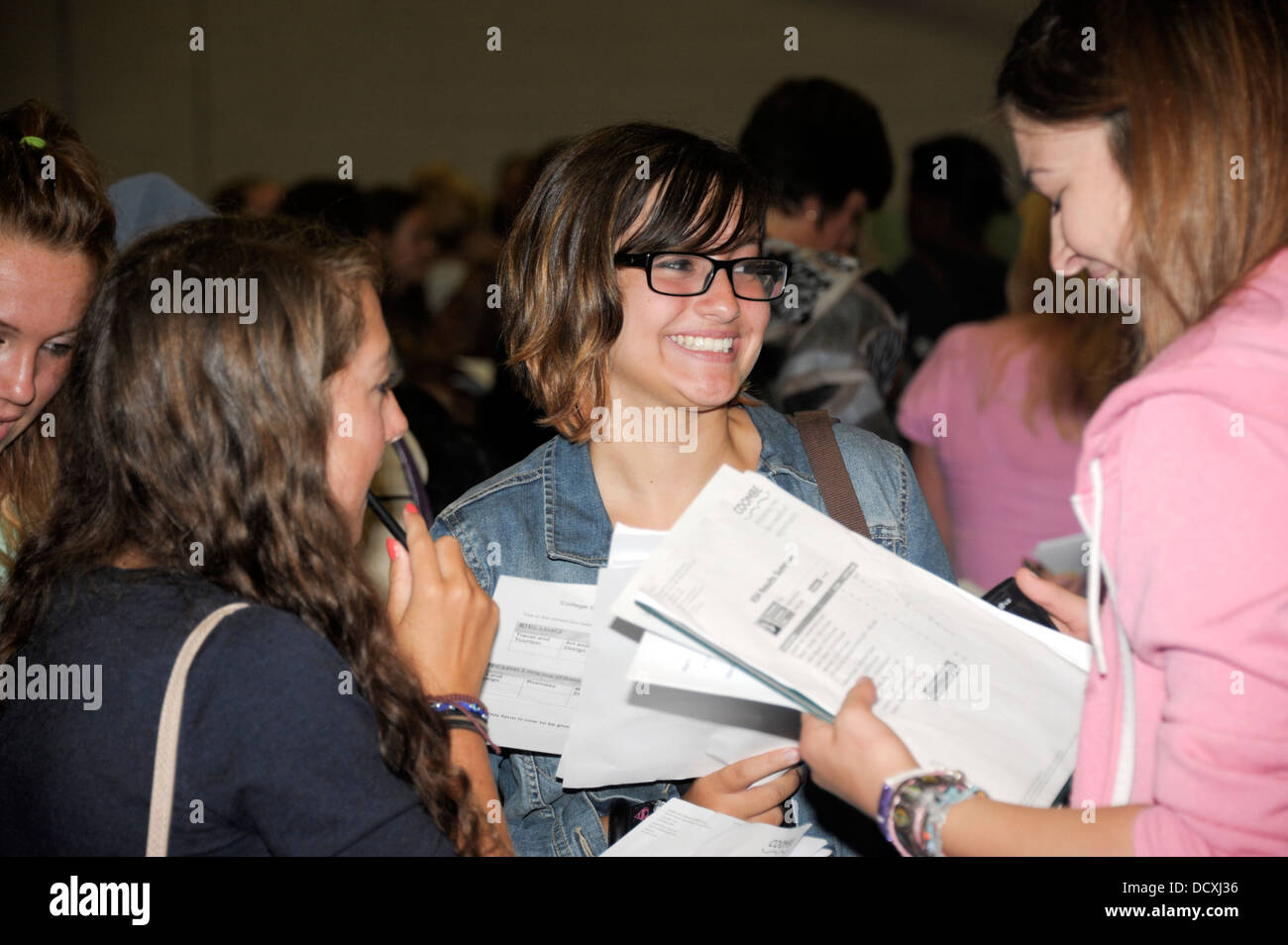 Happy students receiving exam results hi-res stock photography and ...