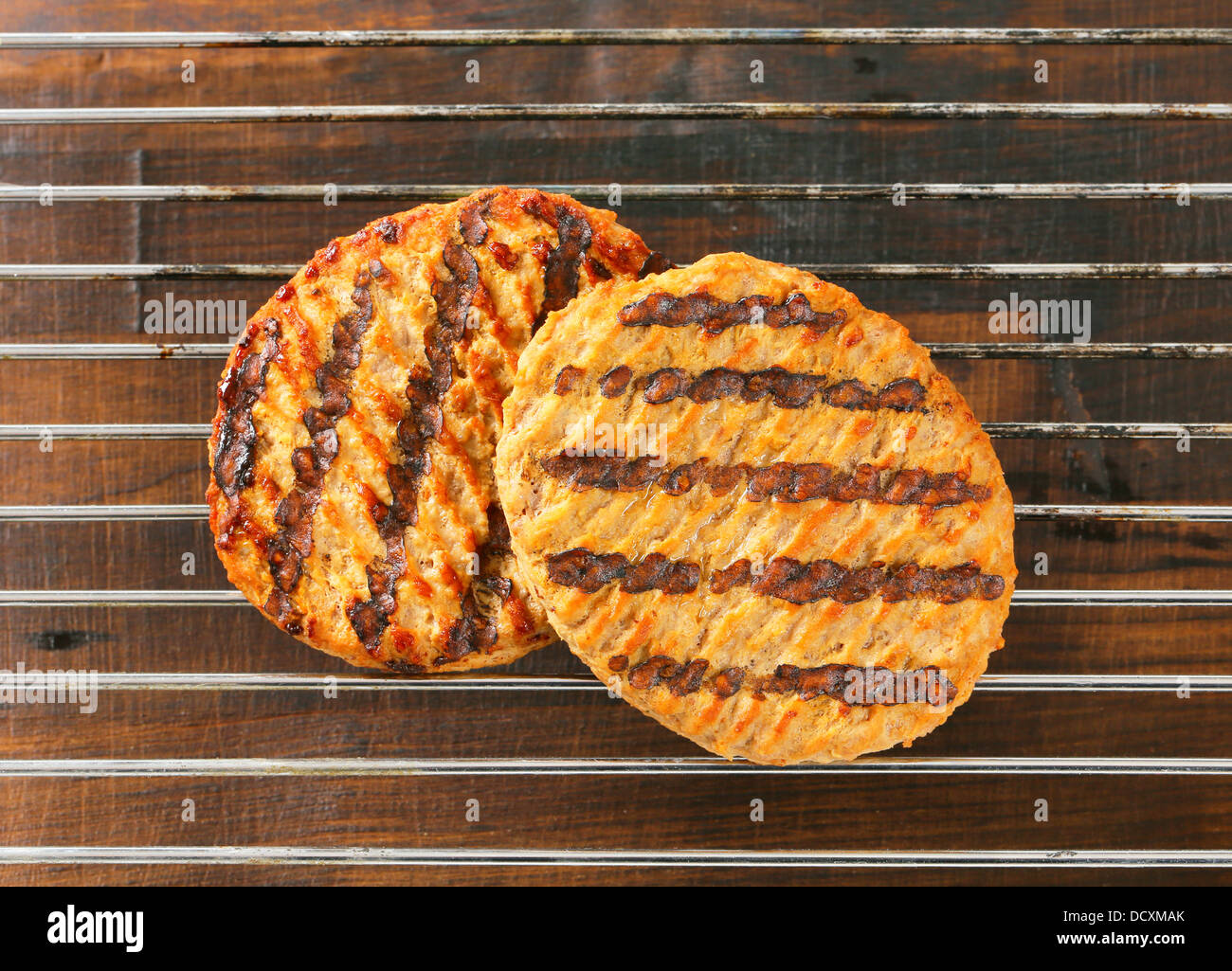 Grilled patties on barbecue grid Stock Photo - Alamy